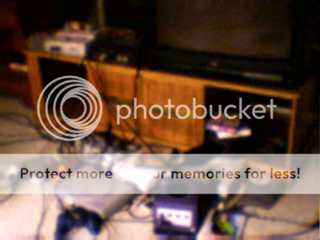 Below the TV we of course see a mass of wires, game CDs and systems ...